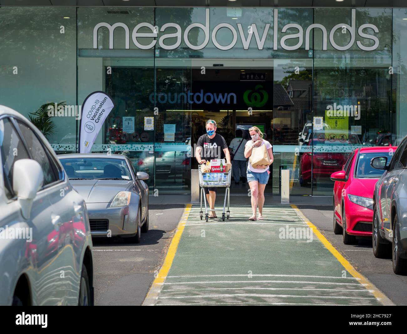 Couple in protective masks leaving Countdown Meadowlands supermarket ...