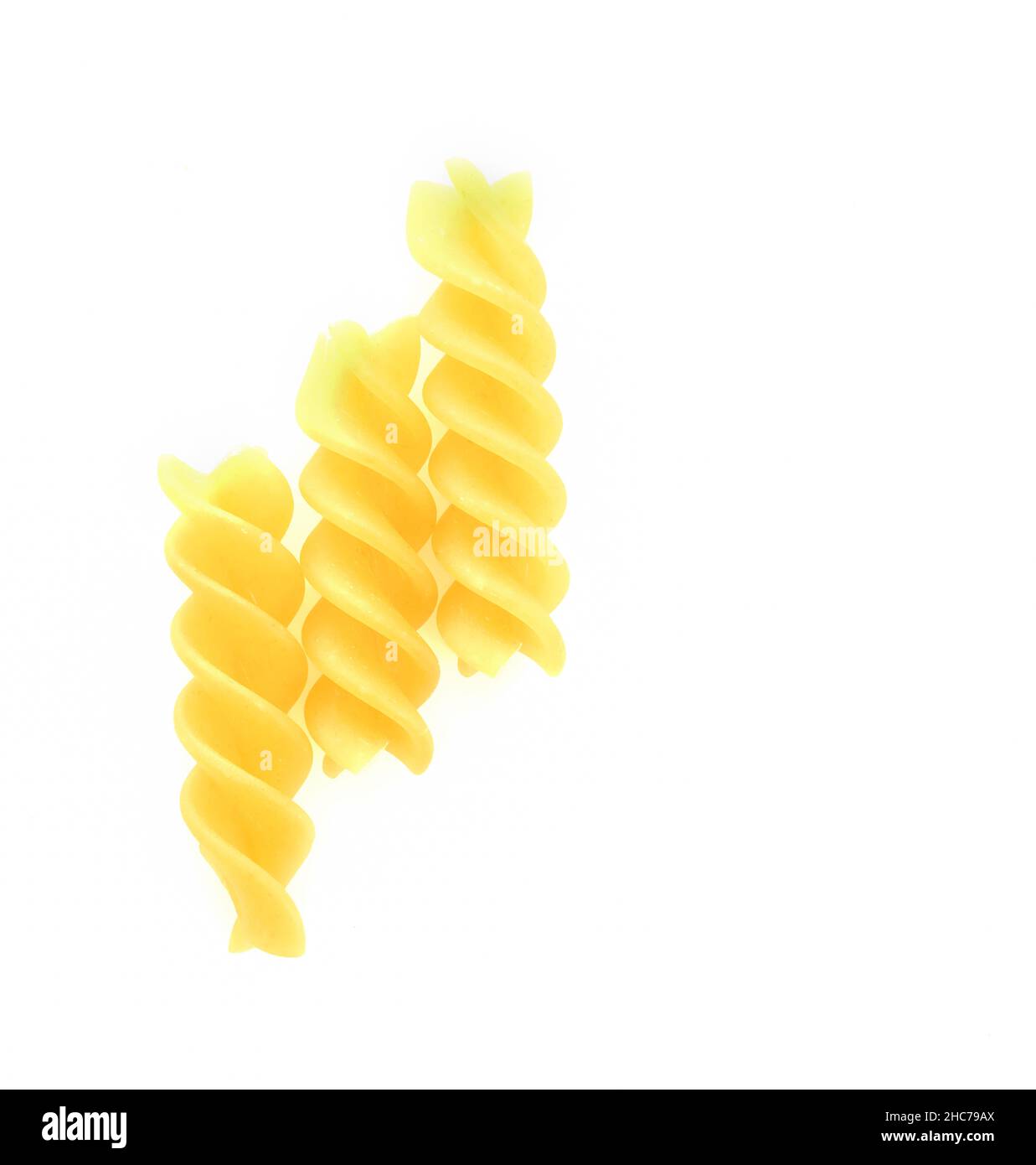 Macro food still life of Fusilli, fuˈzilli, pasta on plain background ...