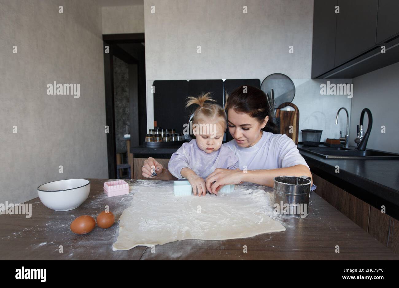 Happy loving family cooking bakery together. Mother and daughter-girl ...