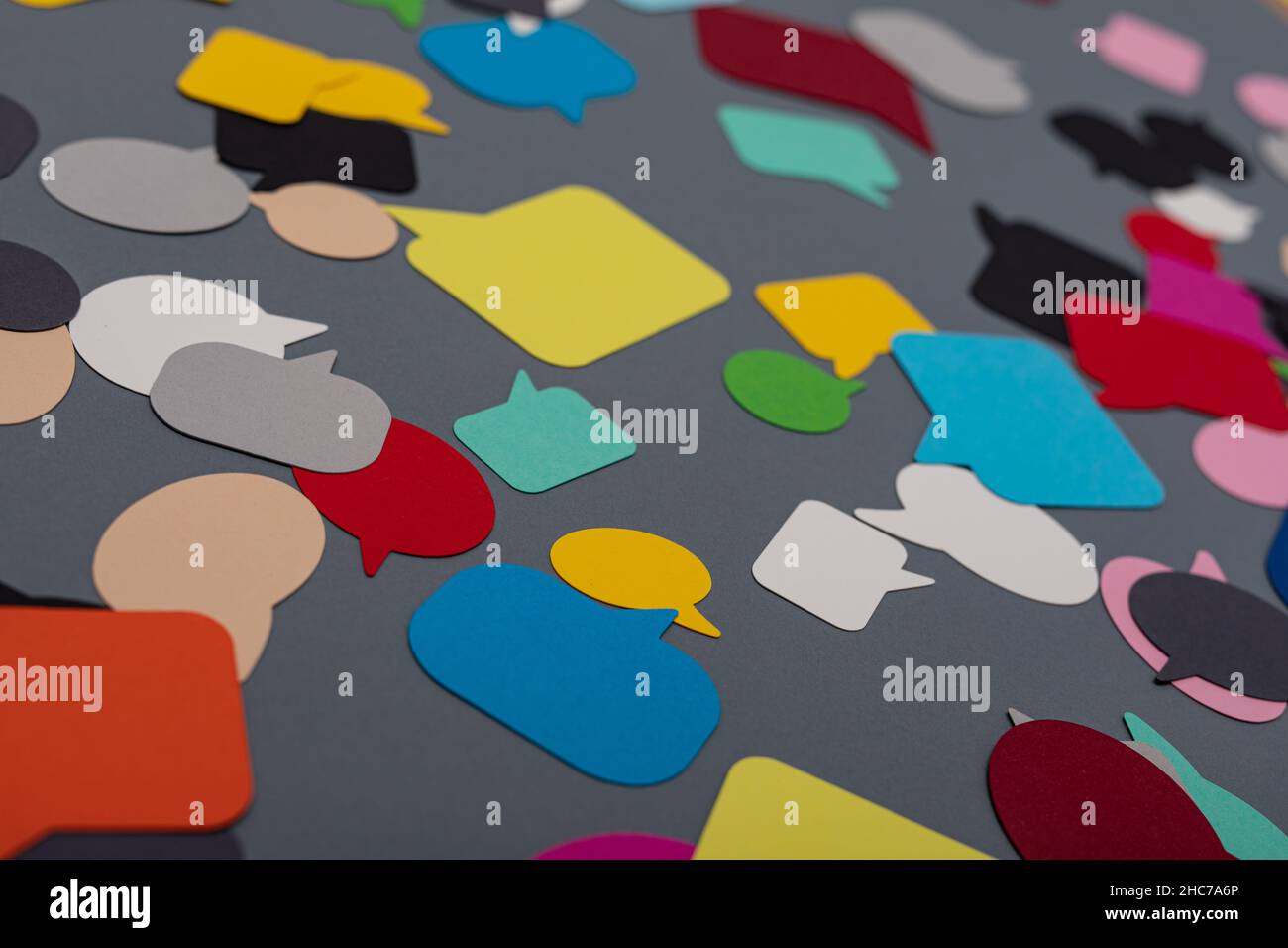 Table with many colorful communication papers speak bubbles Stock Photo ...