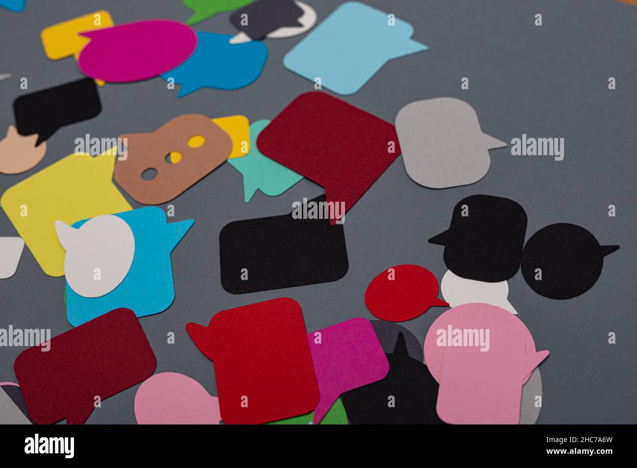 Table with many colorful communication papers speak bubbles Stock Photo ...