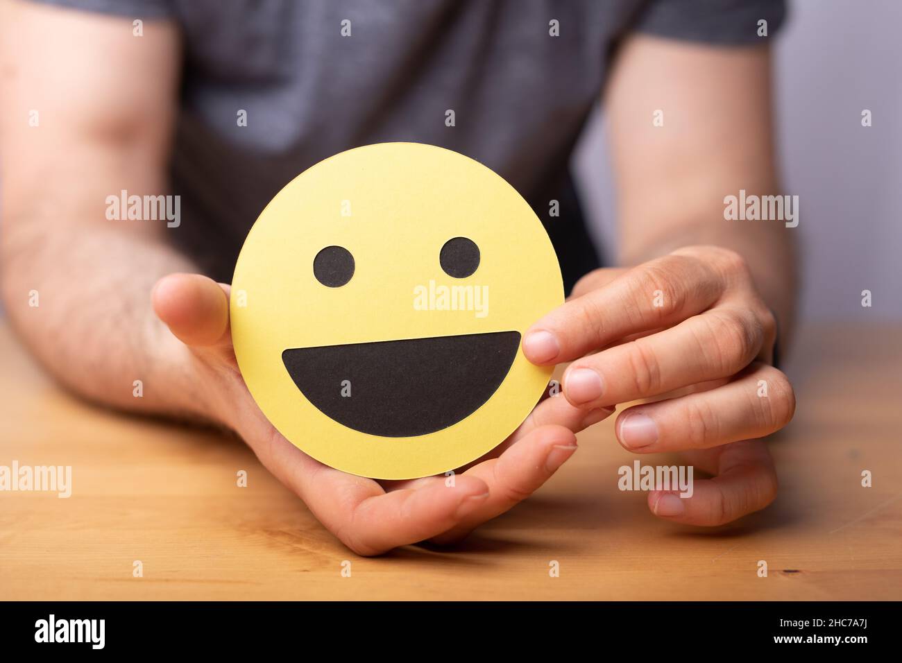 Hand holding a smiley hi-res stock photography and images - Alamy