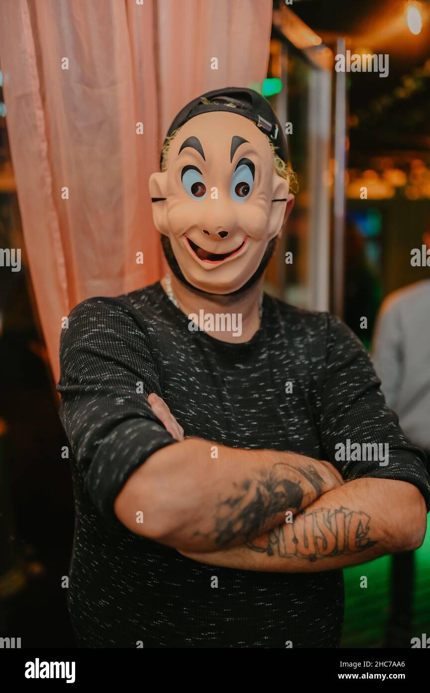 Masked person hi-res stock photography and images - Alamy