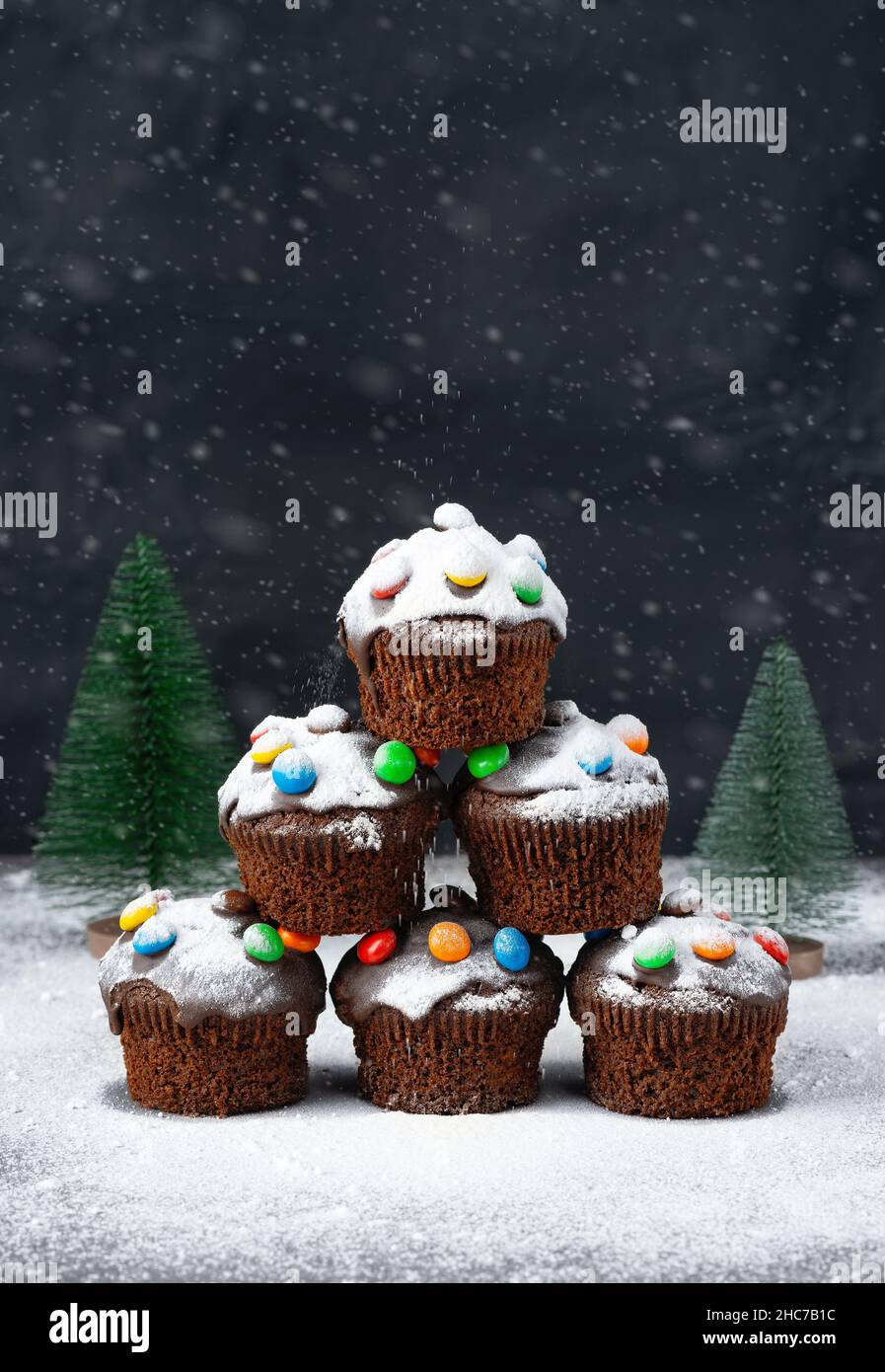 Christmas background with muffins and fir tree Stock Photo - Alamy