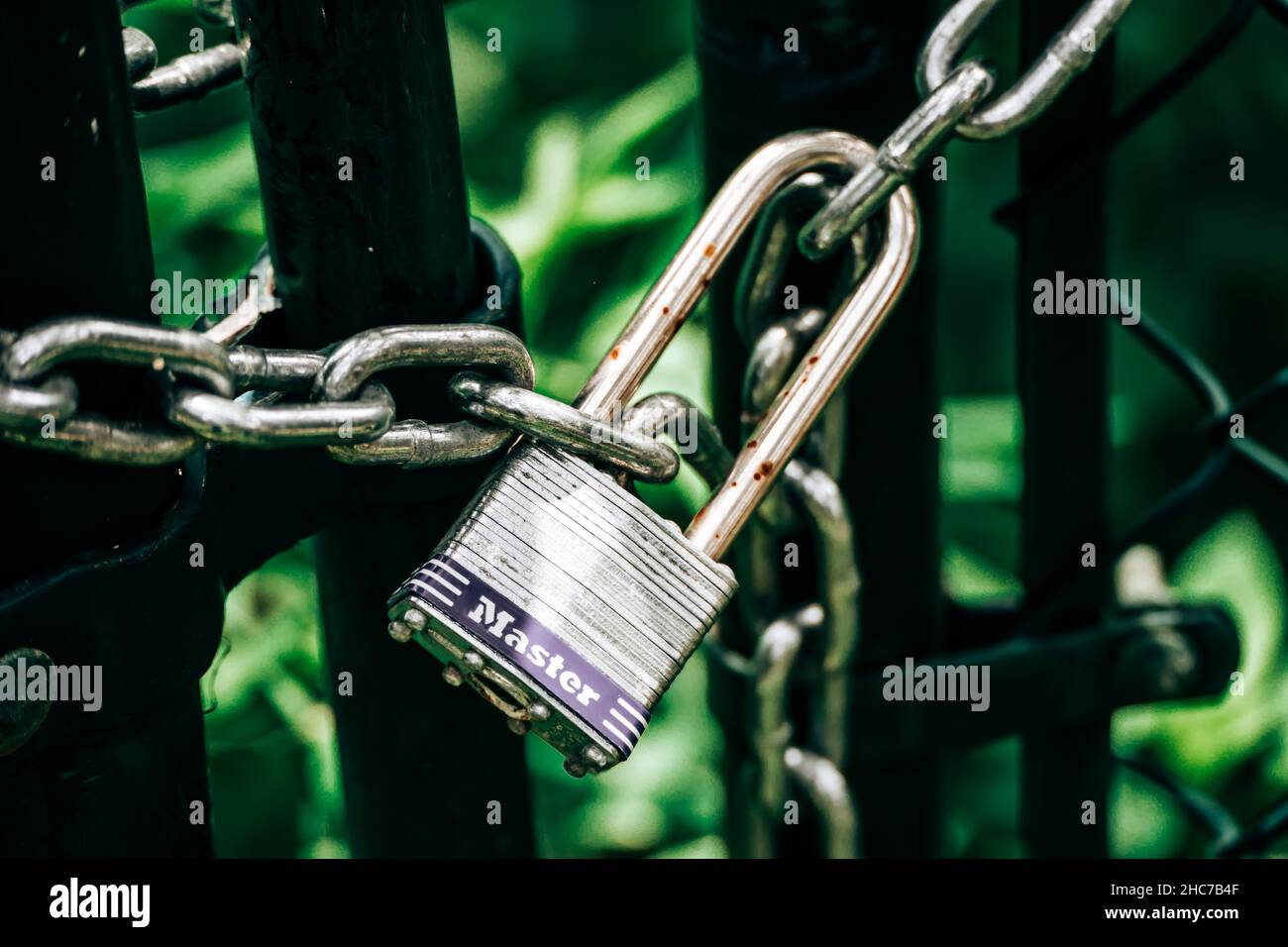 Master lock on an entry gate Stock Photo - Alamy