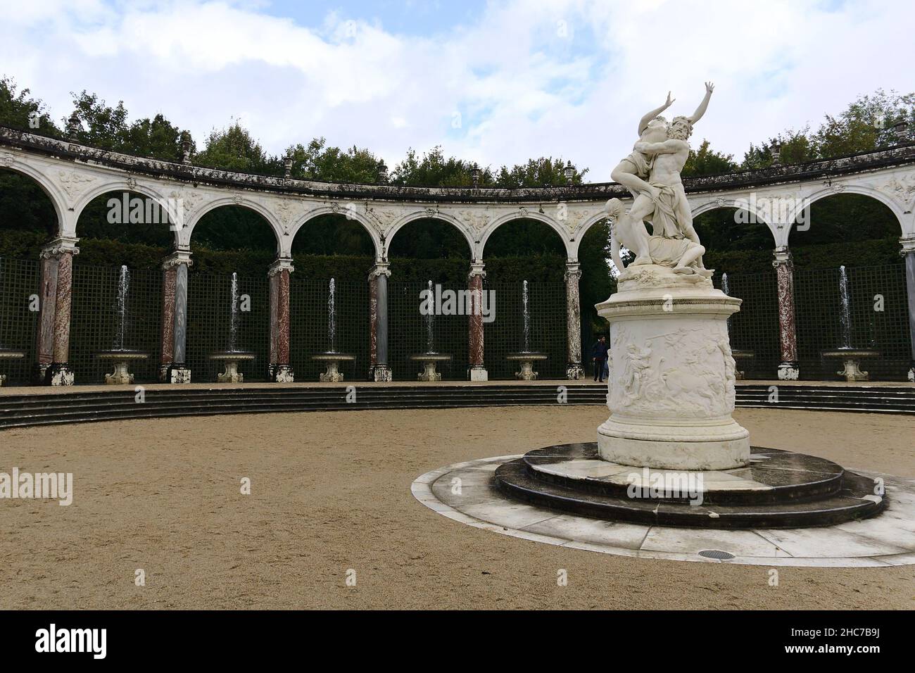 Colonnade grove at Versailles palace against a cloudy sky in Paris ...