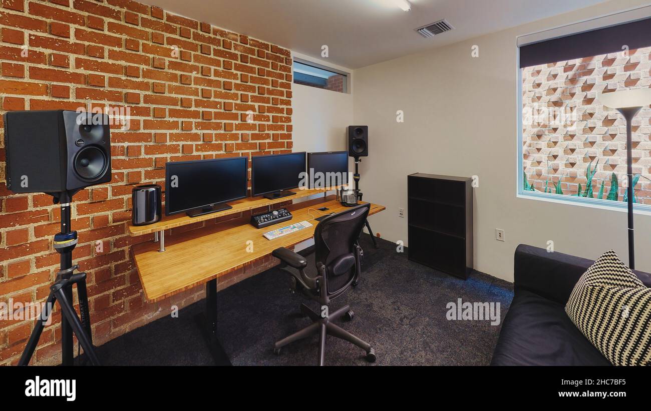 Small office room made for the entertainment industry with a brick wall ...
