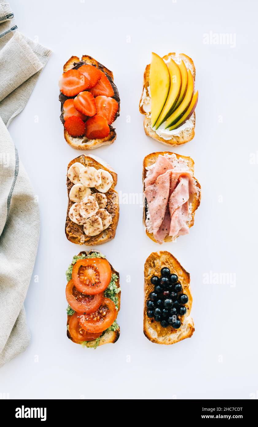 Delicious healthy toasts mix for breakfast, lunch or snack on white ...