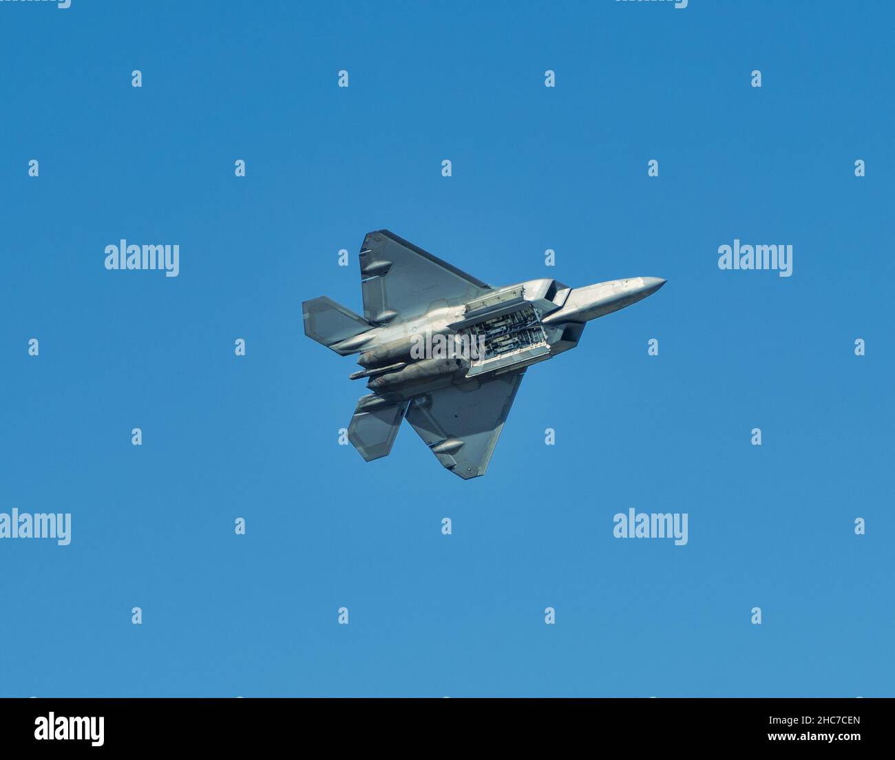 Military jet in the blue sky during the daytime Stock Photo - Alamy