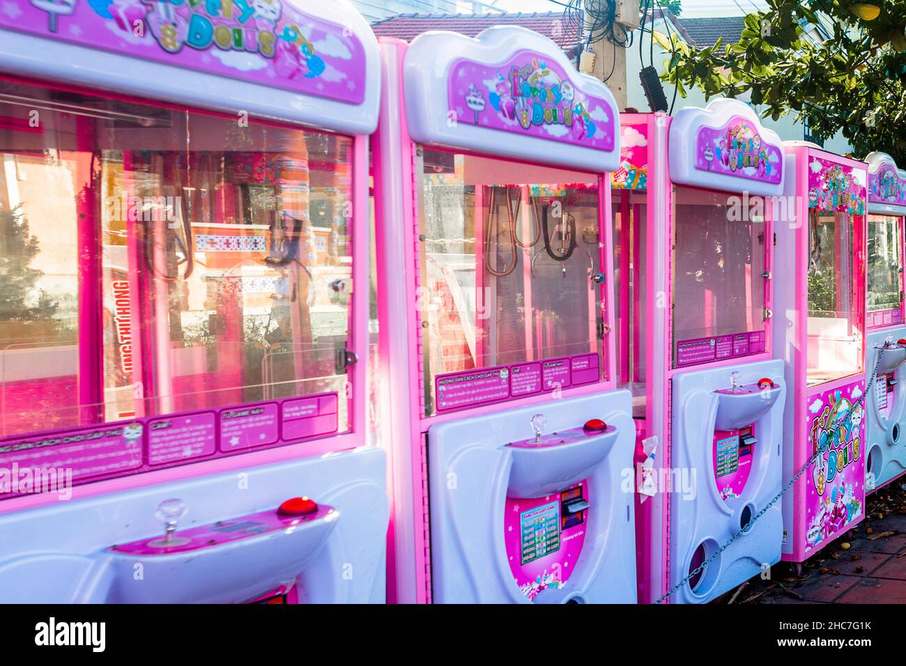 A row of pink game booths that is from an amusement park for kids ...
