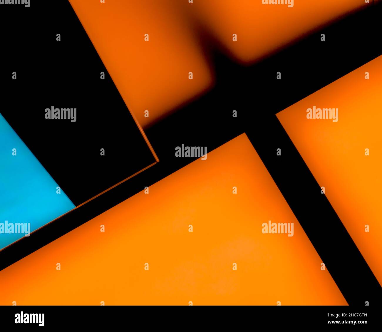 Orange light falling on the angle of a wall on dark background Stock ...