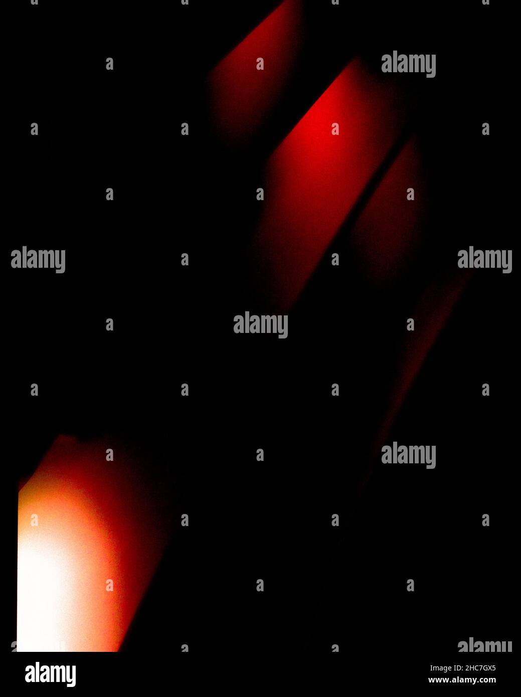 Orange light falling on the angle of a wall on dark background Stock ...