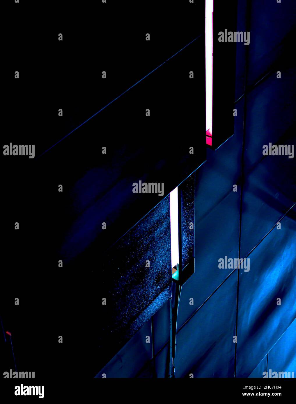 Light falling on the angle of a wall on dark background Stock Photo - Alamy