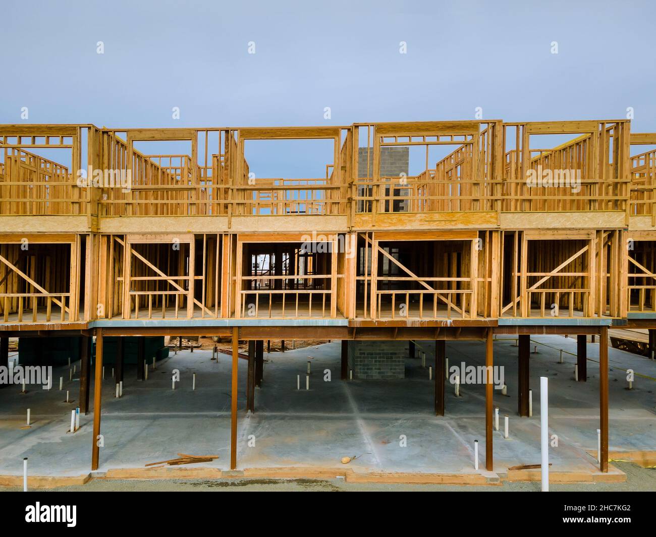 Beams under construction framing of a new unfinished wooden house at a ...