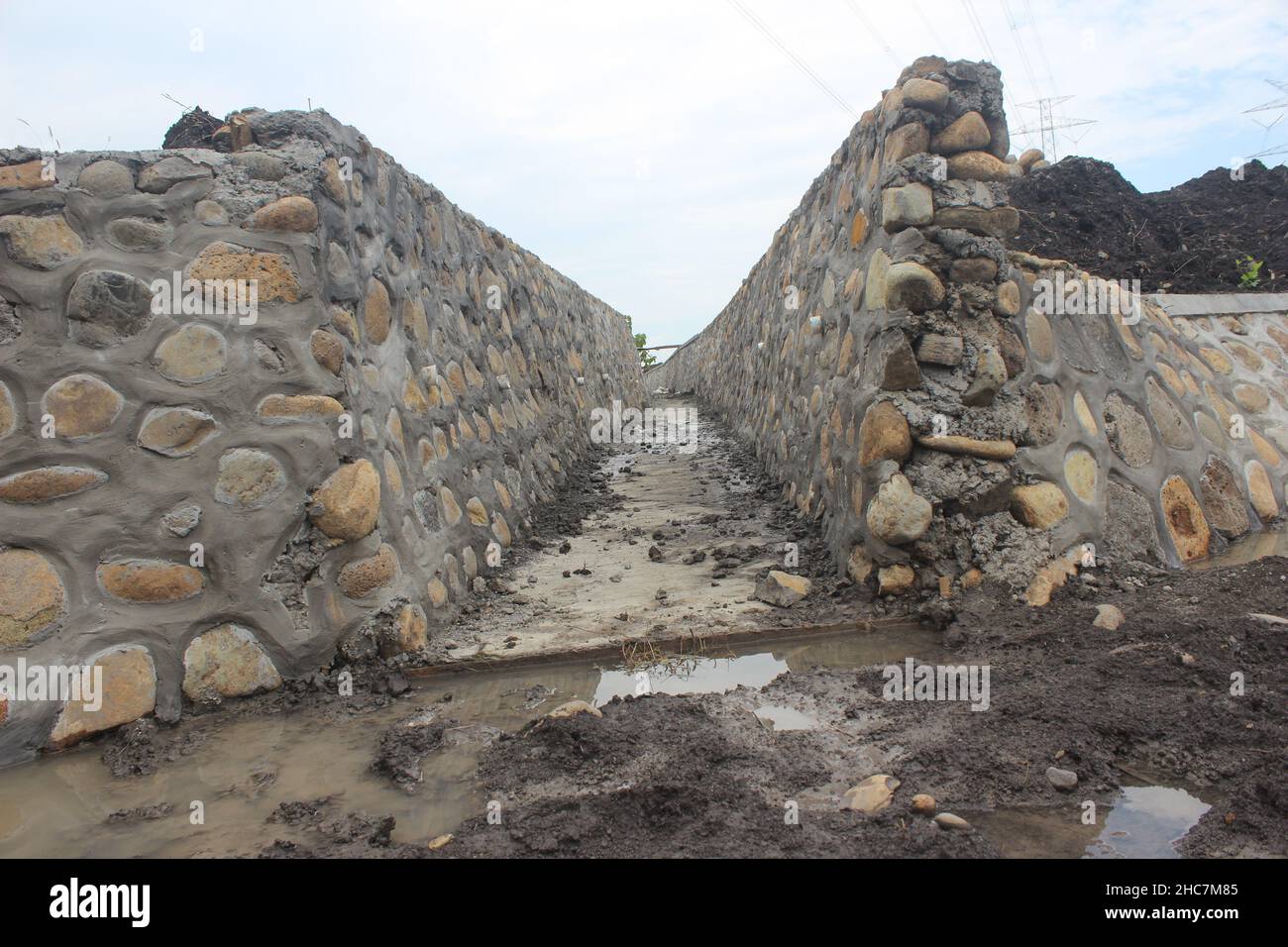 drainage water channel on the side of the road as a place for water ...