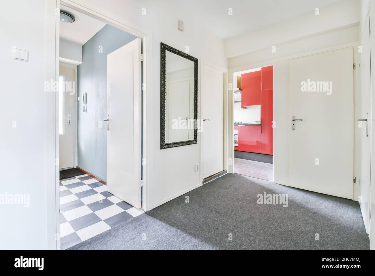 Stylish corridor with gray carpet on the floor Stock Photo - Alamy