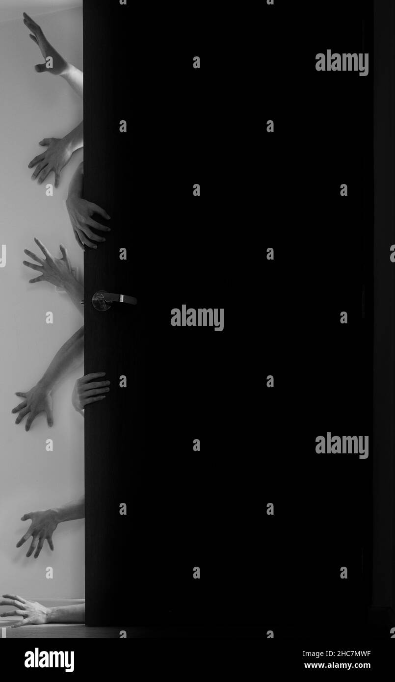 Many hands reaching around a Singapore HDB provided door Stock Photo ...