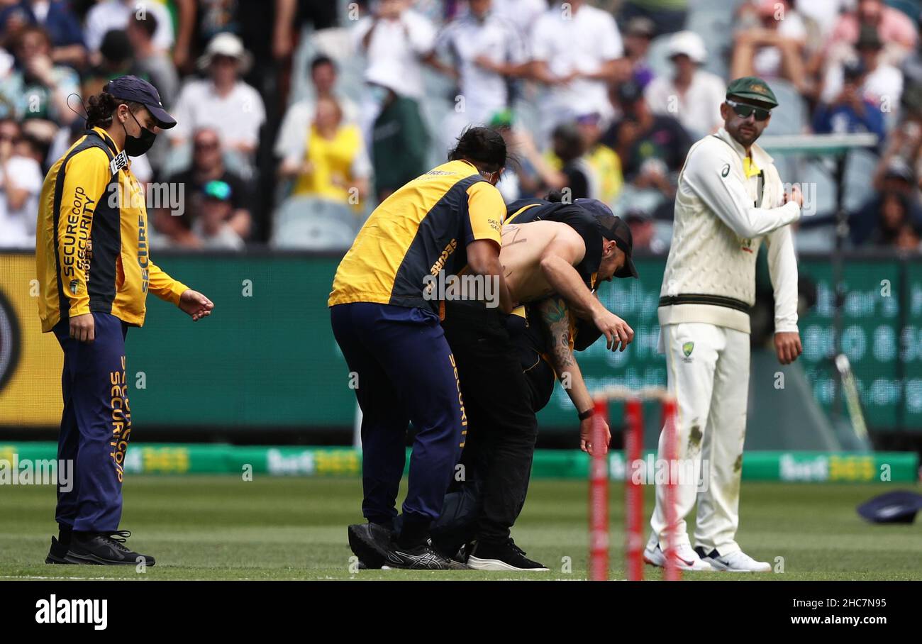 A pitch invader enters the field during day one of the third Ashes test ...