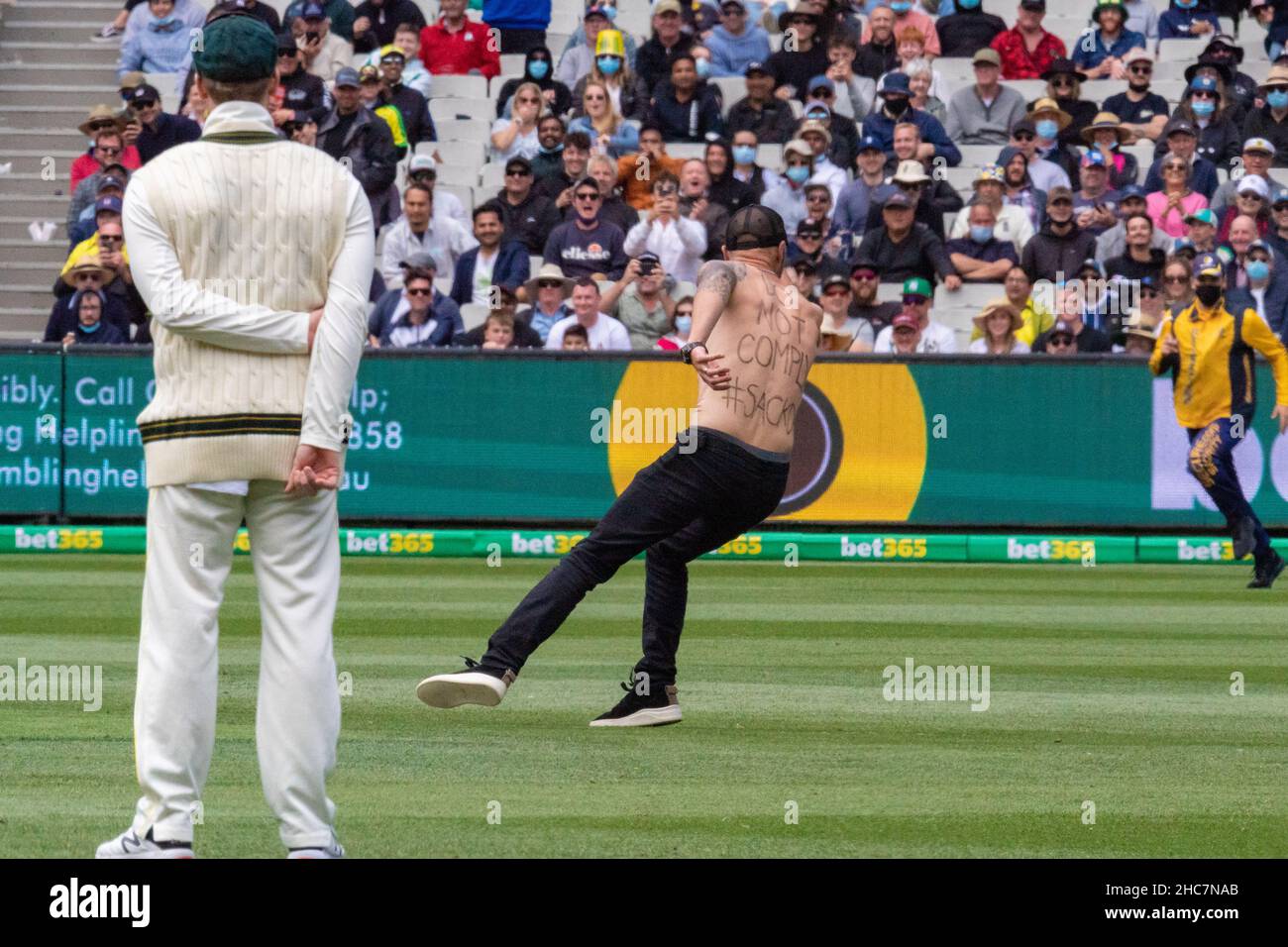 Melbourne, Australia. 26th Dec, 2021. A pitch invader is seen running ...