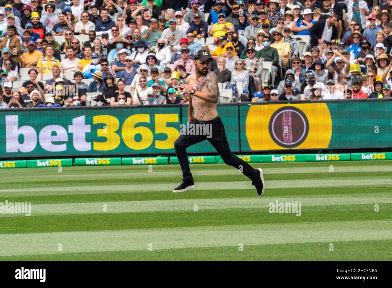Melbourne, Australia. 26th Dec, 2021. A pitch invader is seen running ...