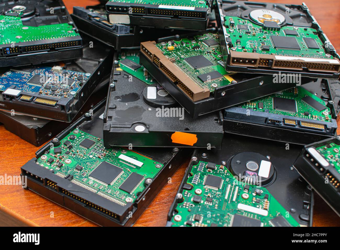 A pile of dusty broken and obsolete hard drives for disposal and ...