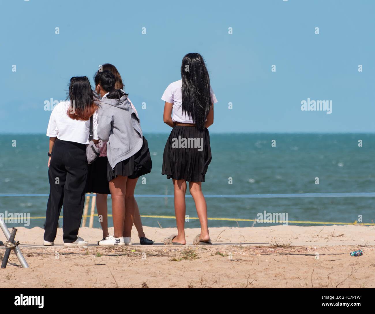 Four female university students on the beach at Surat Thani Kite ...