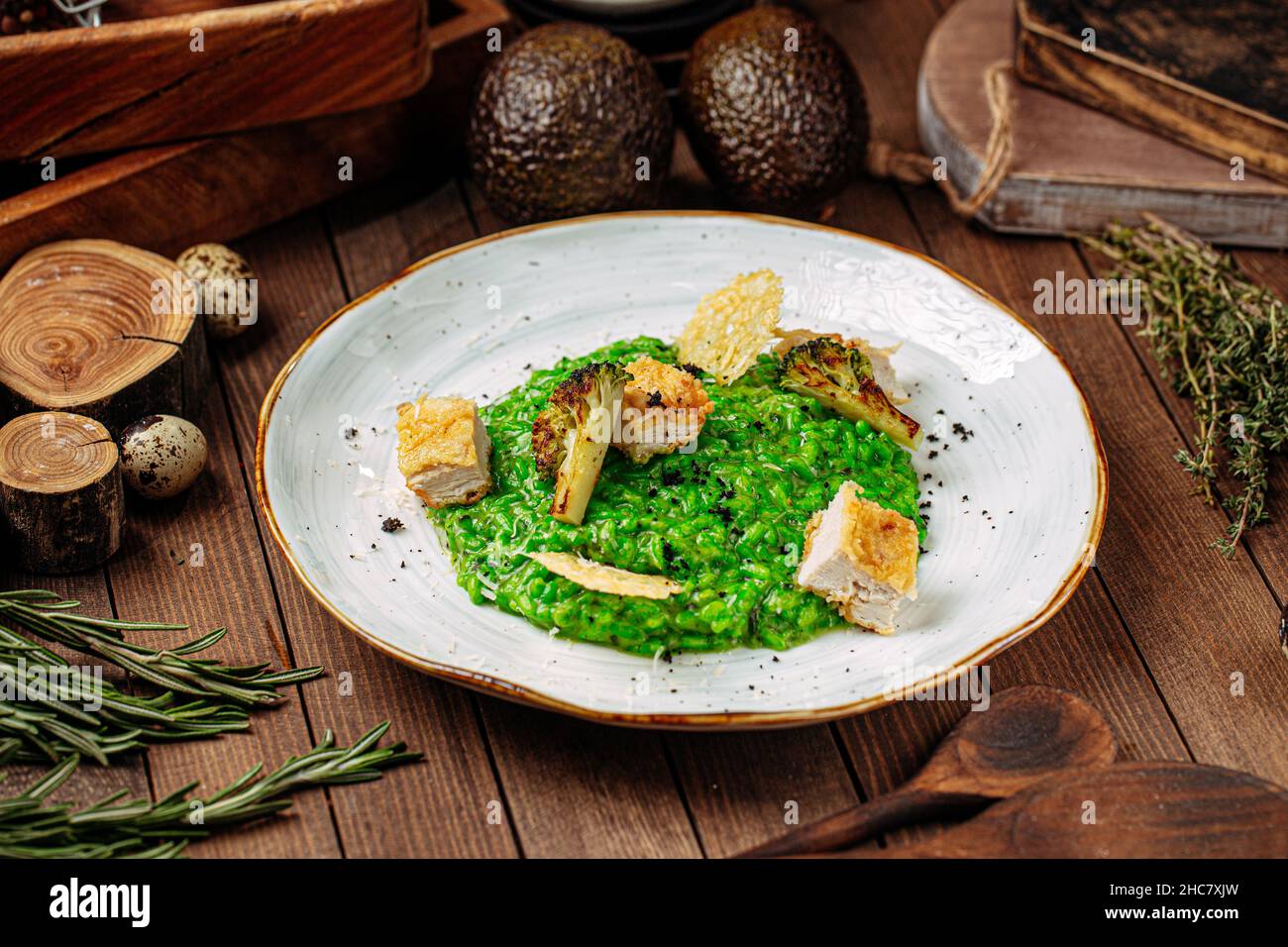 Spinach risotto with fried chicken and broccoli Stock Photo - Alamy