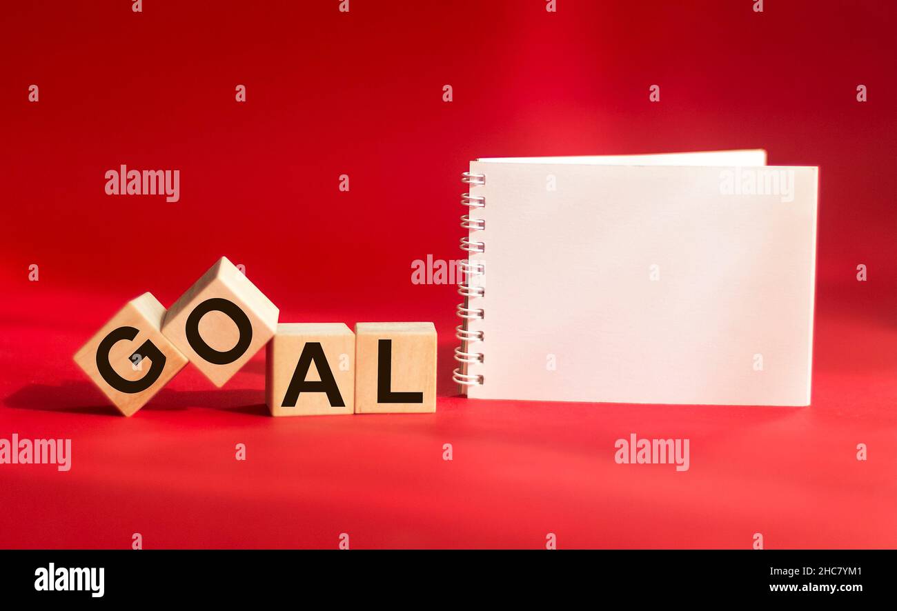 Goal word made from building blocks isolated on red background with ...
