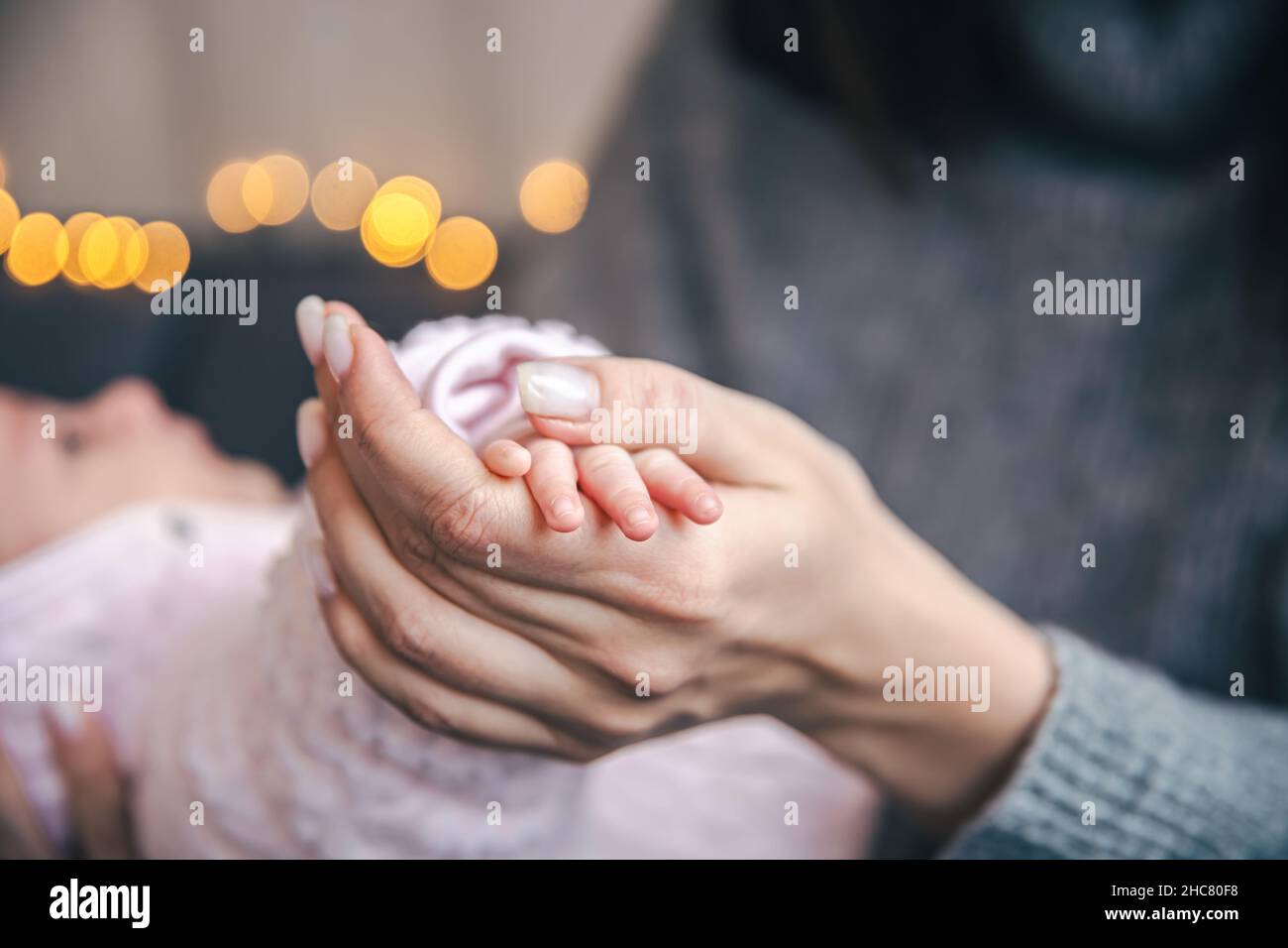 Newborn child holding a pen hi-res stock photography and images - Alamy