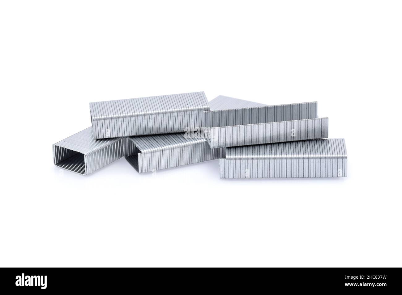 Stack of metal staples isolated on white background Stock Photo - Alamy