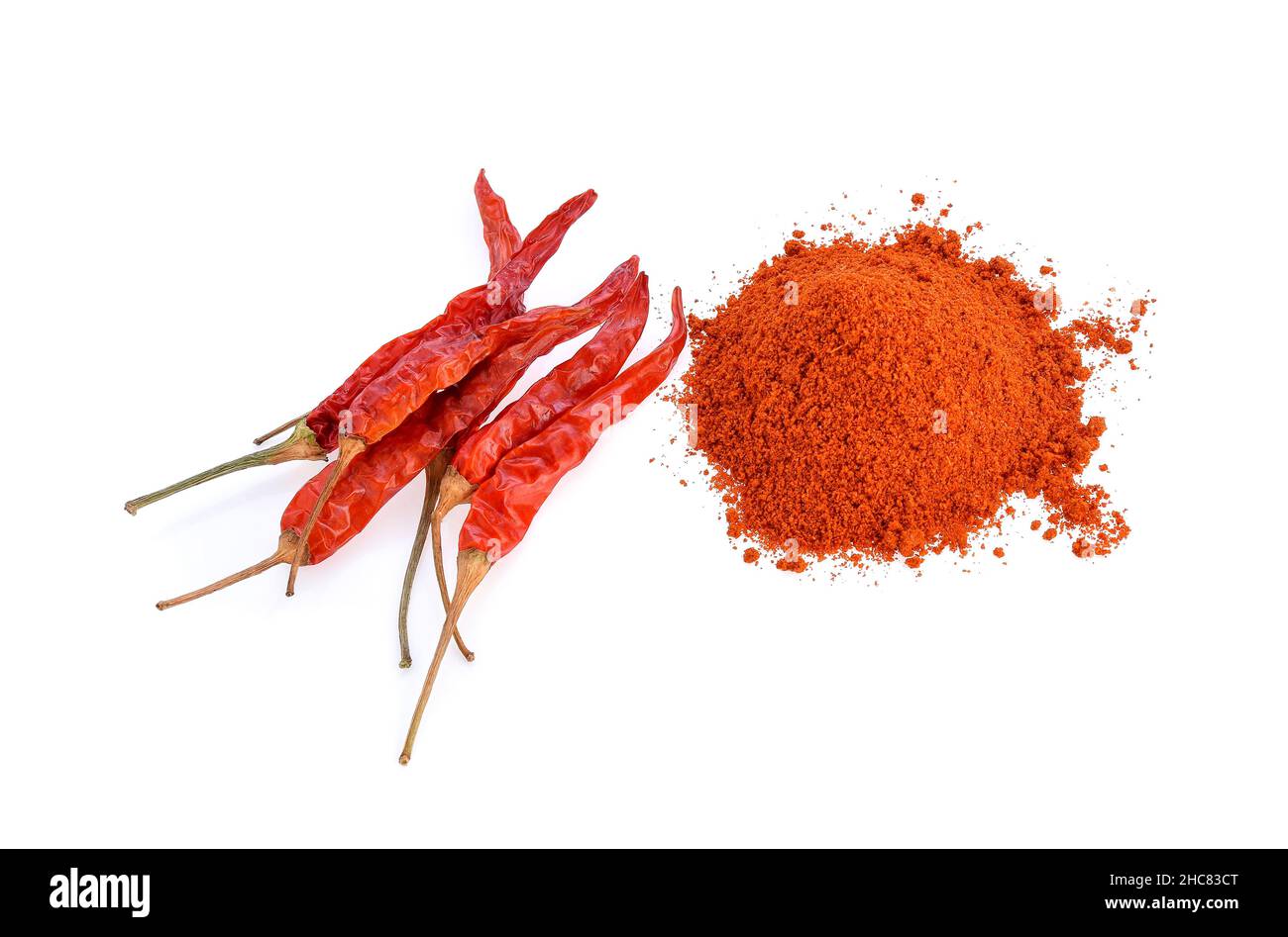 Cayenne pepper in wood spoon on white background Stock Photo - Alamy