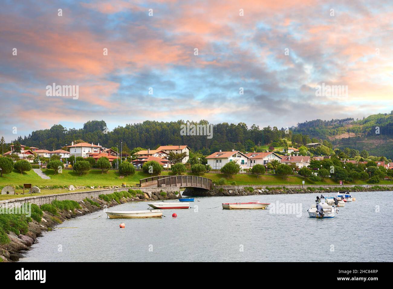 residential area with chalets, wooden pedestrian bridge and small ...