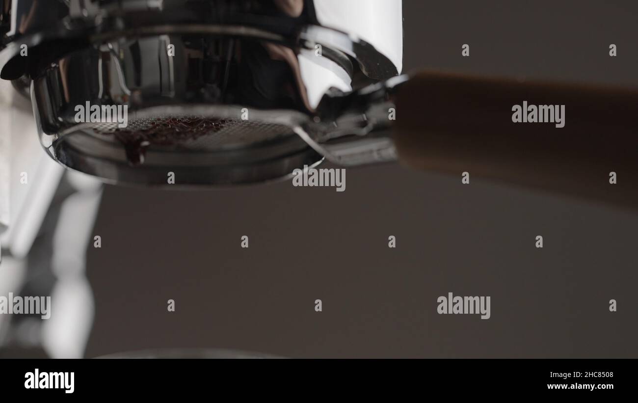 pull espresso shot with bottomless portafilter on a professional coffee ...