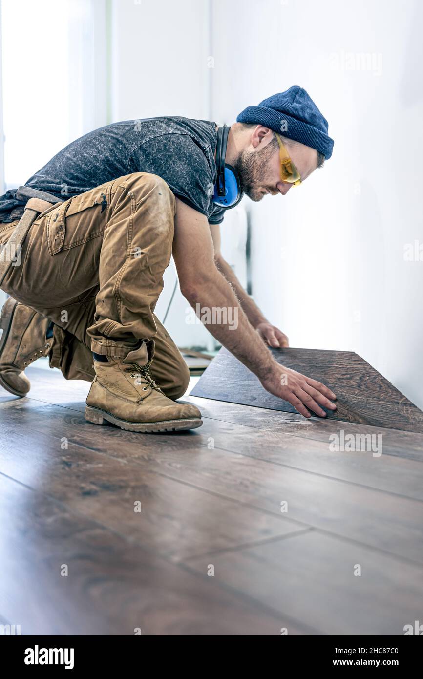 Man puts new flooring hi-res stock photography and images - Alamy