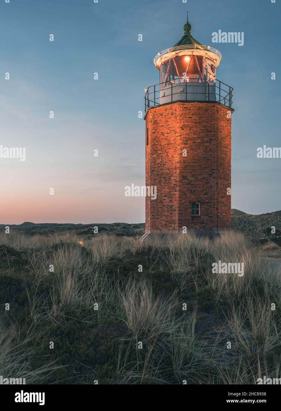 Beautiful view of an old brick Lighthouse with typical heathland plants ...