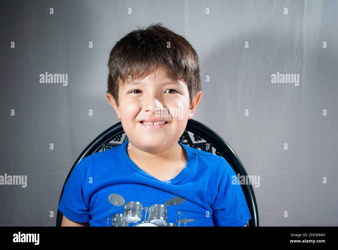 Young boy posing to the camera showing his face and expressions Stock ...
