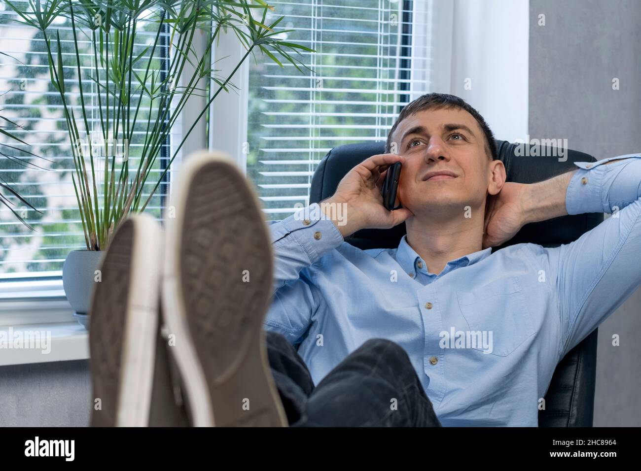 Lazy businessman with feet up hi-res stock photography and images - Alamy