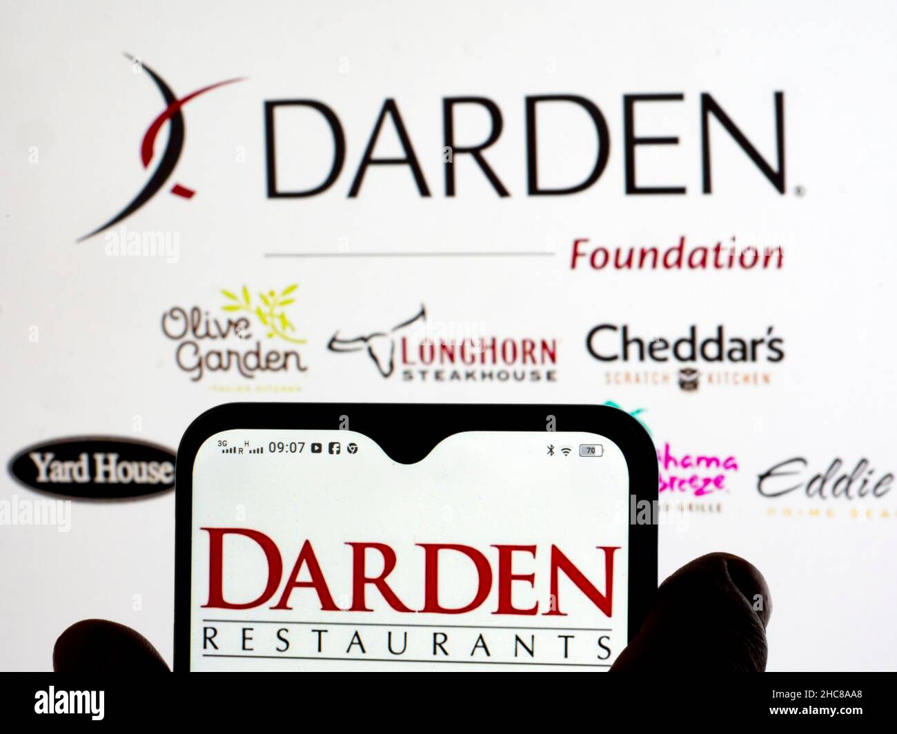 In this photo illustration the Darden Restaurants logo seen displayed ...