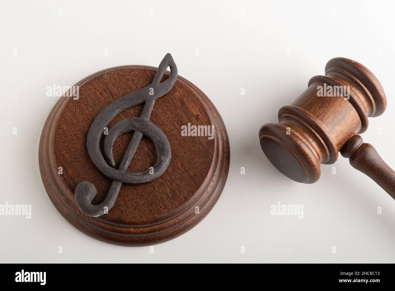 Treble clef and wooden gavel. Music piracy concept. Music Licensing ...