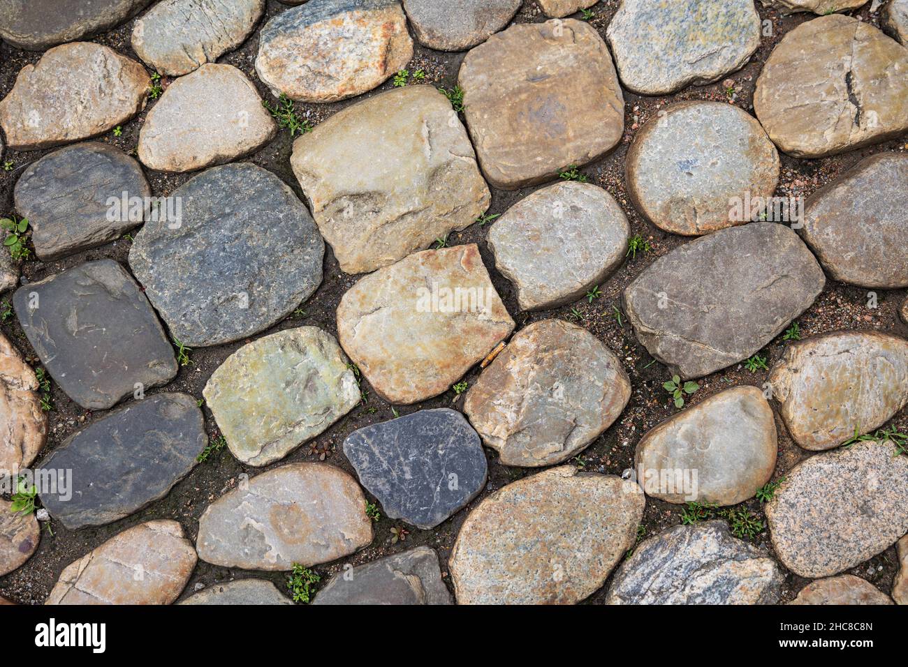 Old rounded cobblestone pavement in old town of Freiburg im Breisgau ...