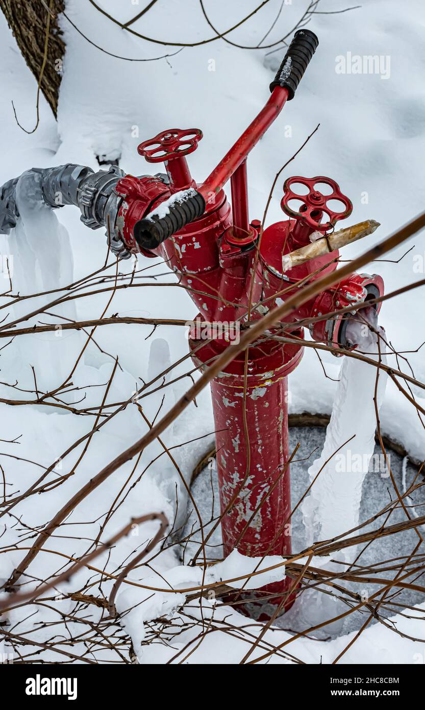 red fire hydrant with frozen water jet. High quality photo Stock Photo ...