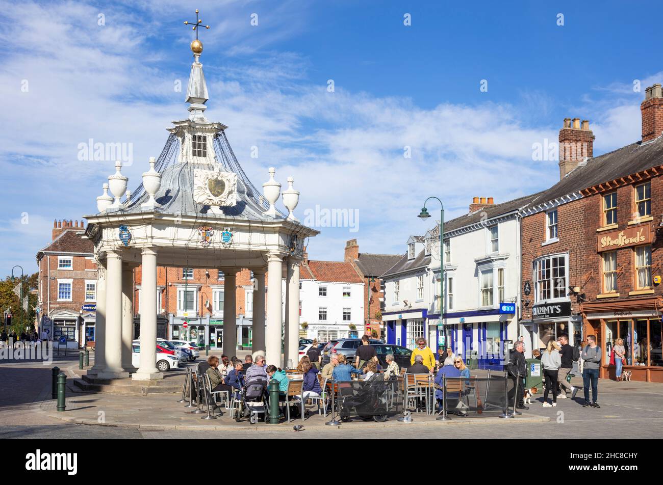 THE MARKET CROSS and cafe on SATURDAY MARKET in the Market town of ...