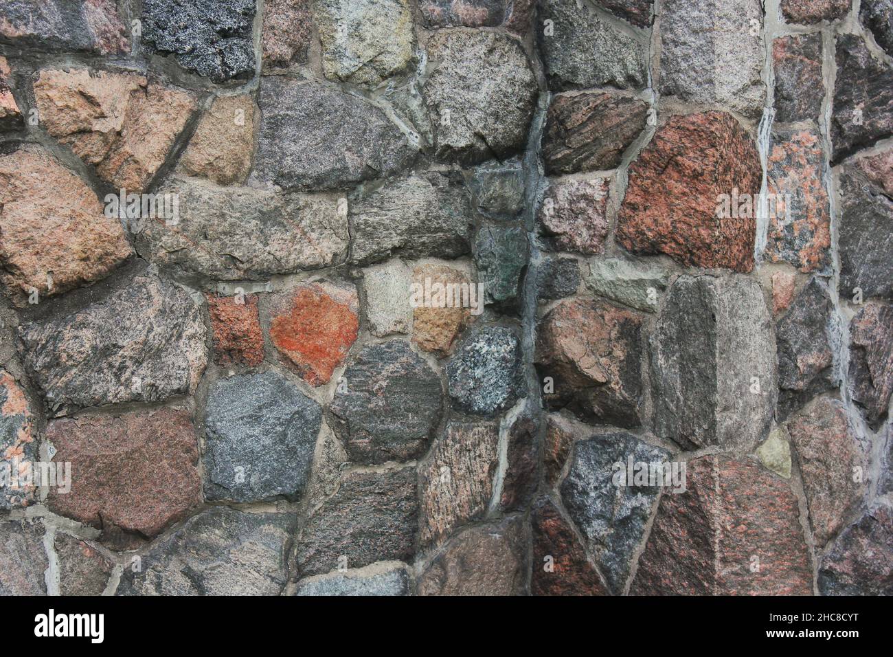 Old stone wall built from huge granite boulders, stones, and rocks ...