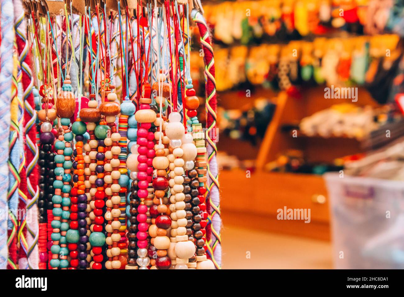 Souvenir stall with variety of colorful souvenirs - wooden beads ...