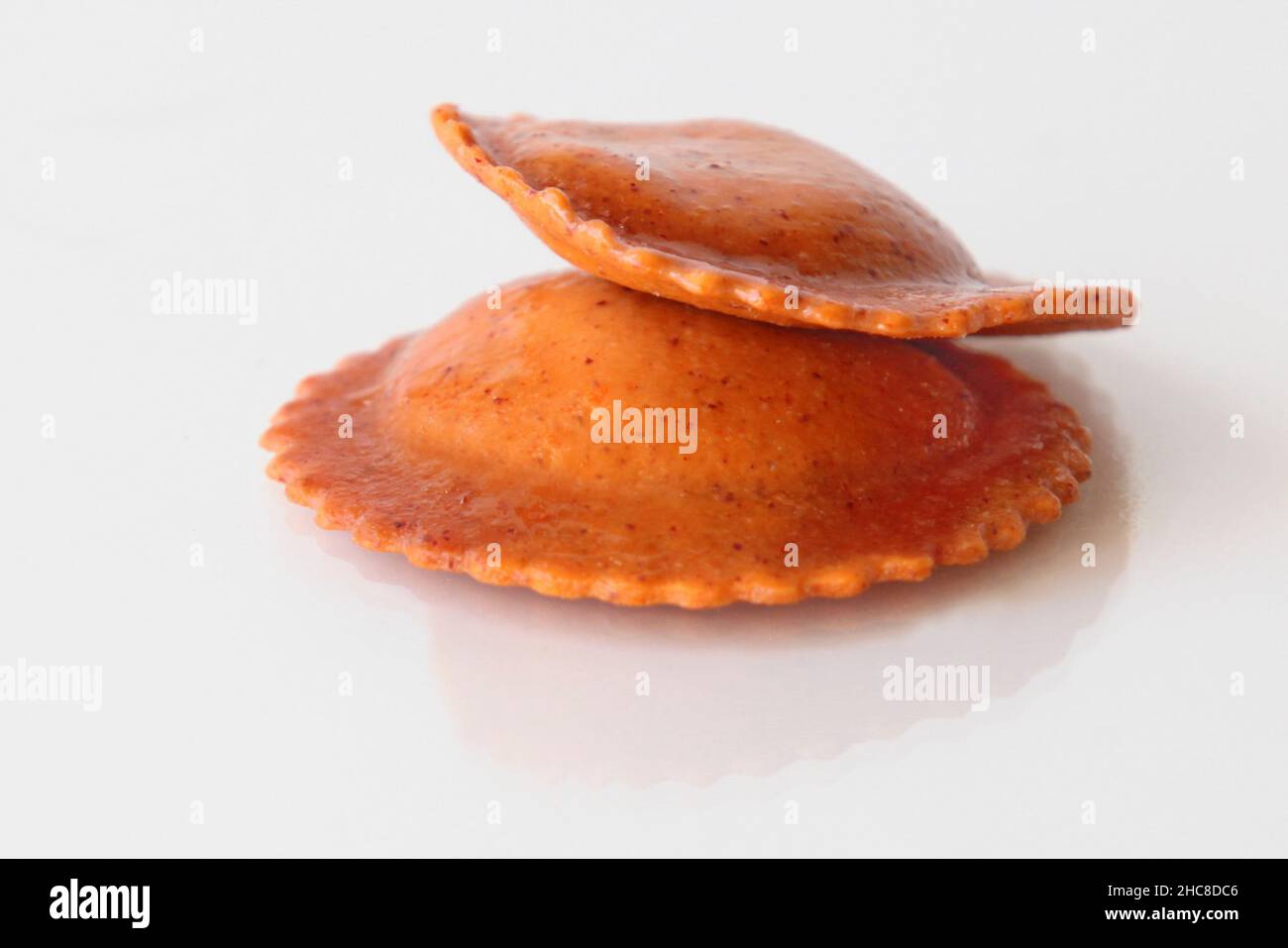 Fresh uncooked Sweet potato flavoured Ravioli (Stuffed Pasta) on white ...