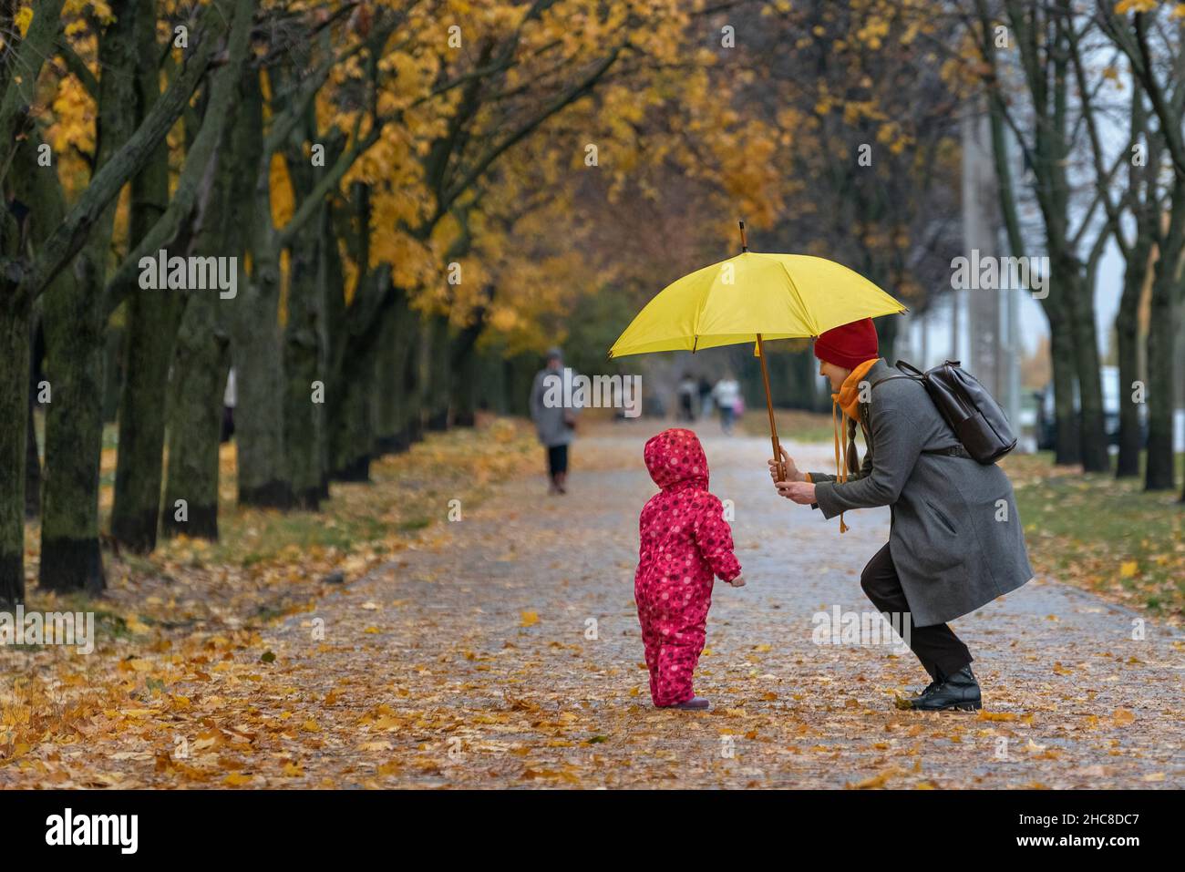 Boy hiding from rain hi-res stock photography and images - Alamy