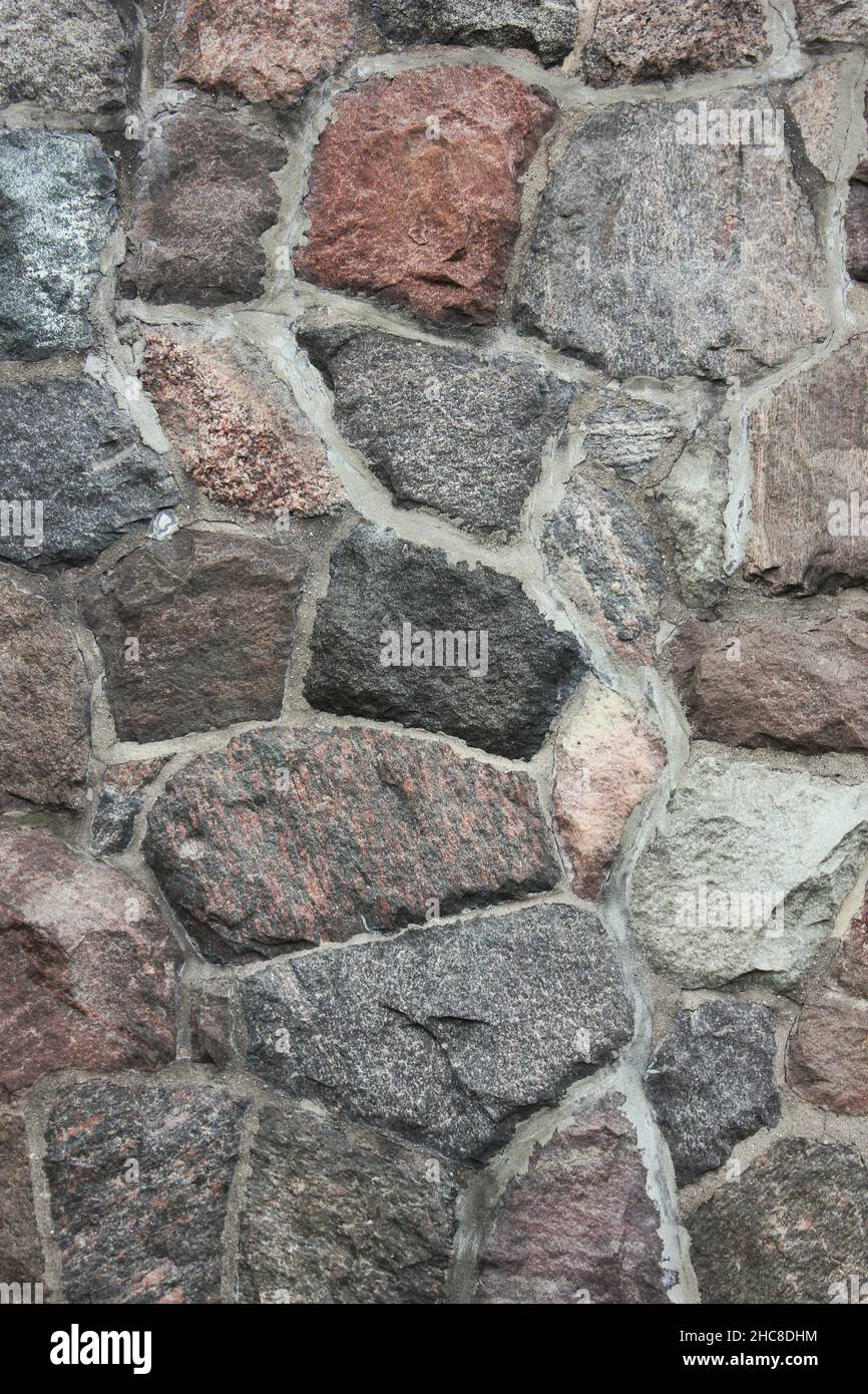 Old stone wall built from huge granite boulders, stones, and rocks ...