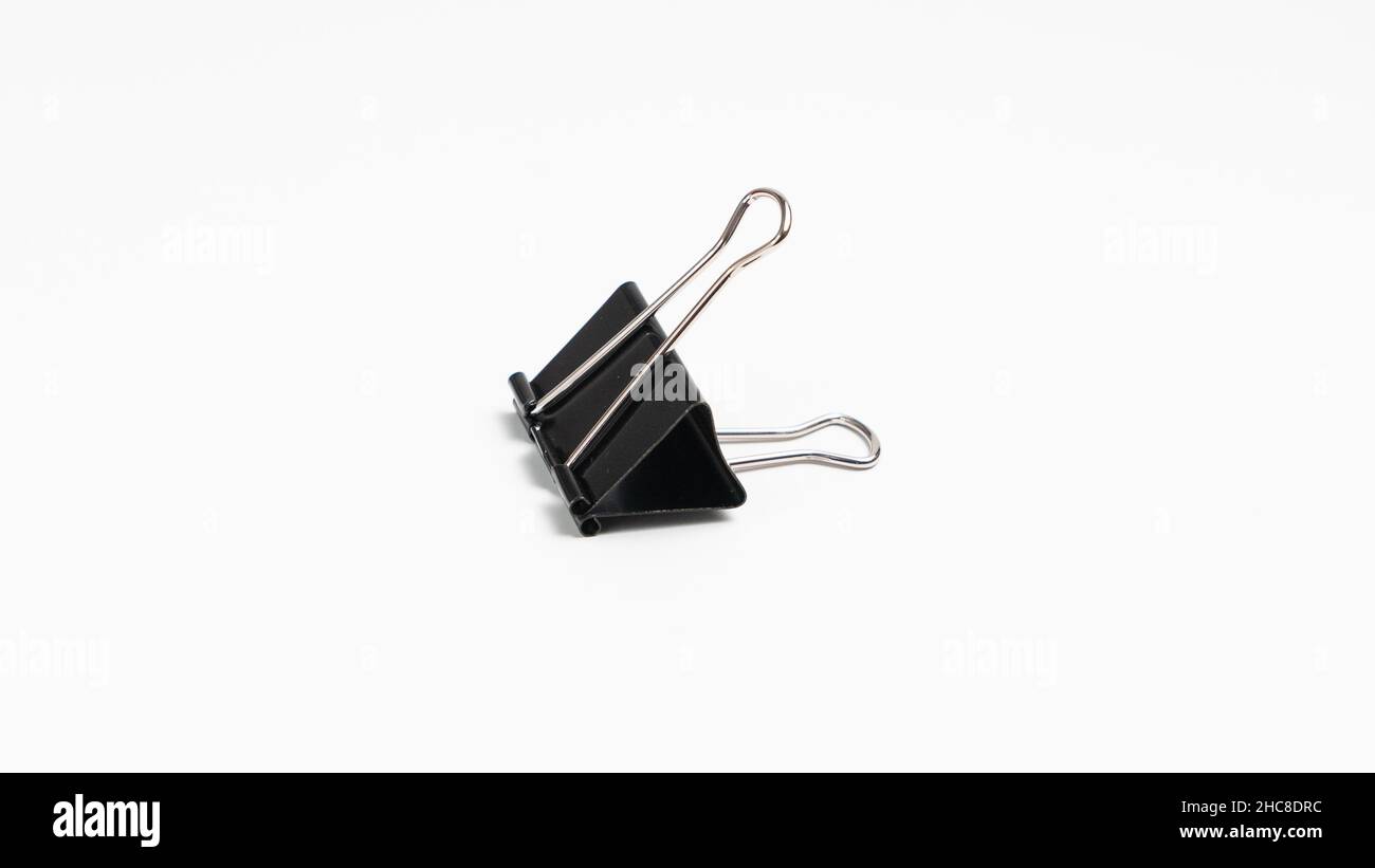 Black paper clip hook on a white background Stock Photo - Alamy