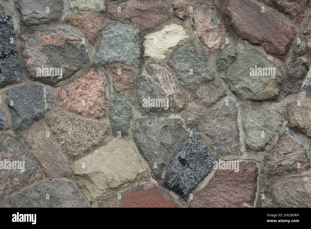 Old stone wall built from huge granite boulders, stones, and rocks ...