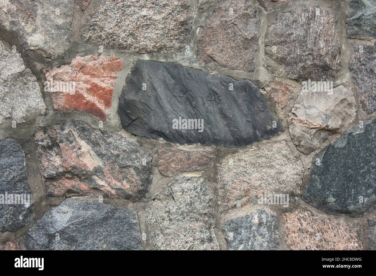 Old stone wall built from huge granite boulders, stones, and rocks ...